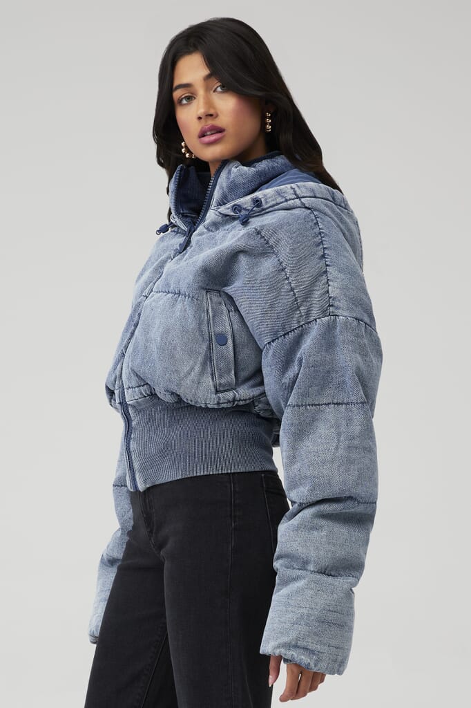 Good American | Cropped Rib Hem Denim Puffer in Indigo586| FashionPass